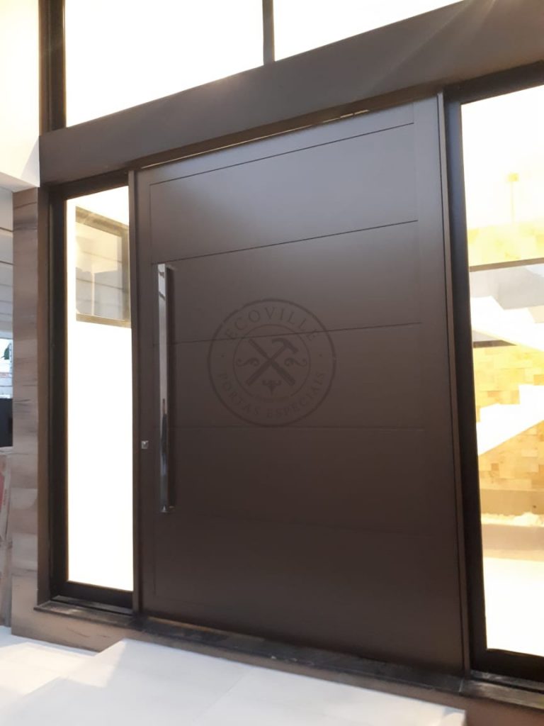 Porta pivotante em ACM cor bronze 1003 - Ecoville Portas Especiais